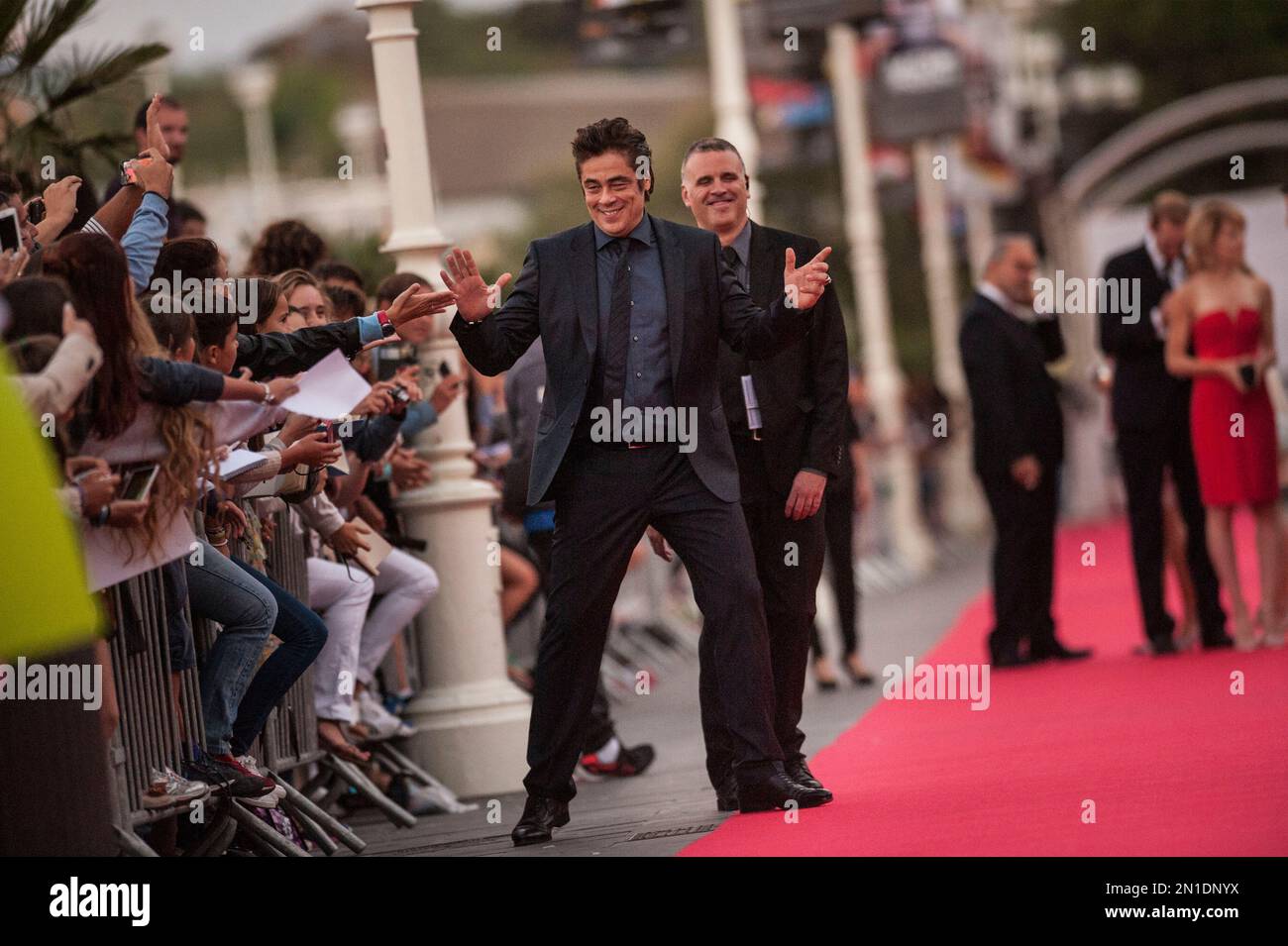 Puerto Rican actor Benicio del Toro gestures beside fans after arriving ...
