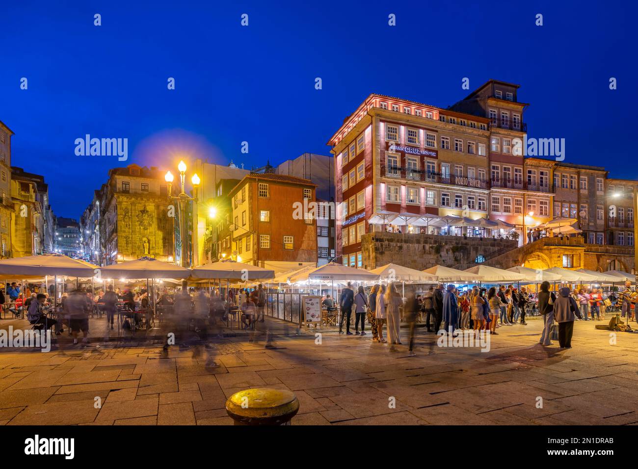 View of bars and restaurants at waterfront of Douro River at dusk ...