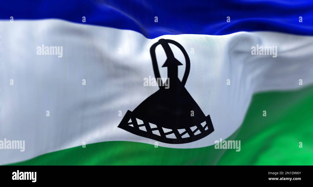 Detail of the Lesotho national flag waving. Horizontal blue, white, and ...