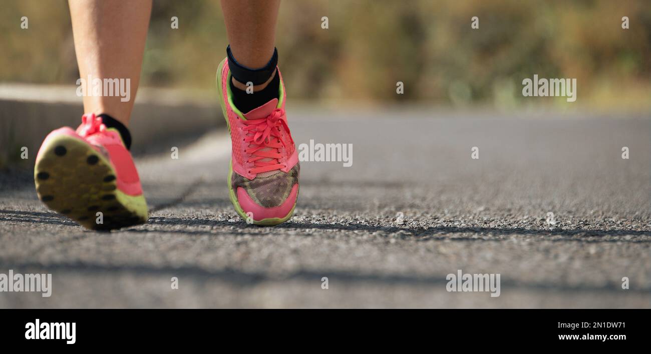 Fitness woman runner athlete running at road, working out cardio on ...