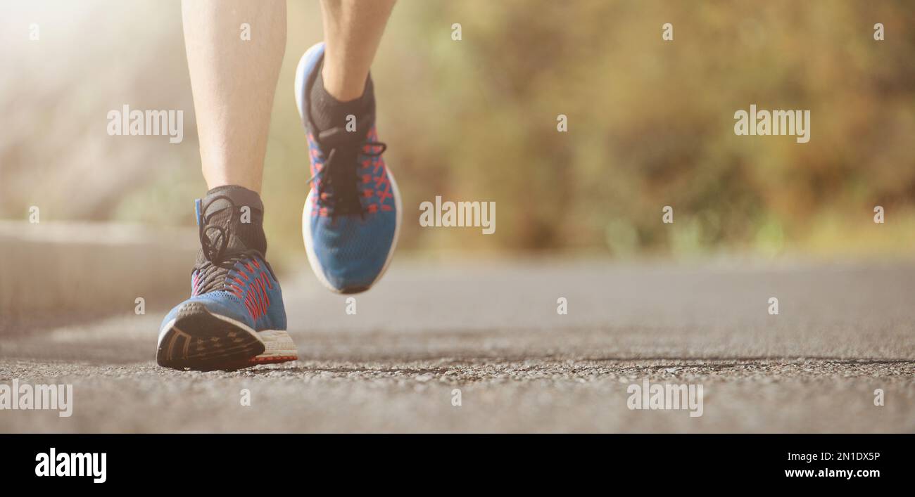 Fitness man runner athlete running at road, working out cardio on ...