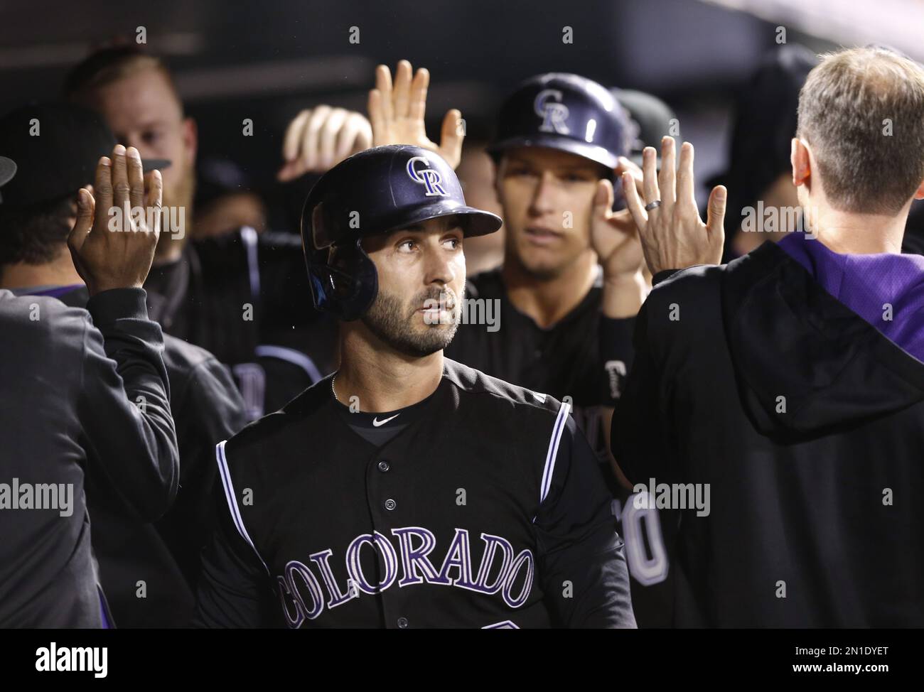 Colorado Rockies' Daniel Descalso, front center, is congratulated along ...