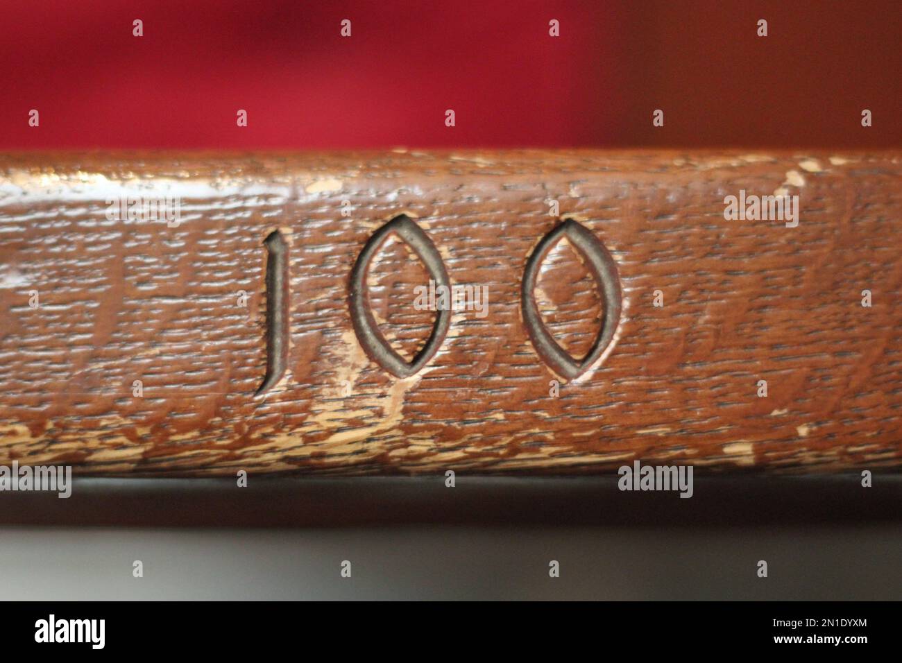 The number 100 carved into aged oak wood Stock Photo - Alamy