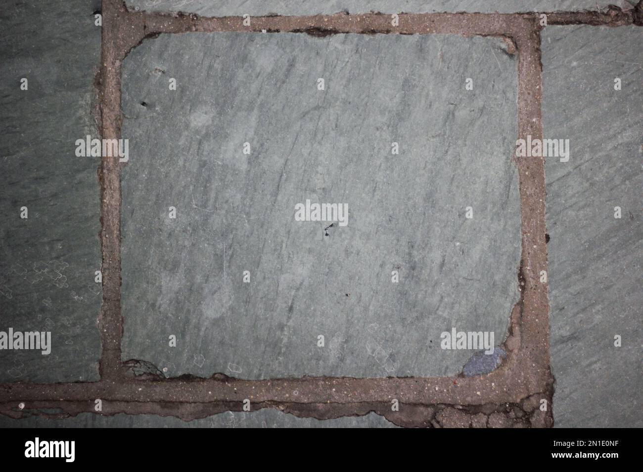 Massive gray slate flooring with a square module Stock Photo - Alamy