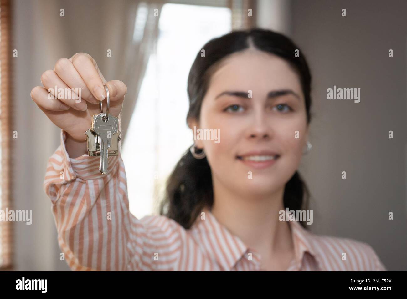 Purchase of real estate. Portrait of young caucasian woman realtor ...