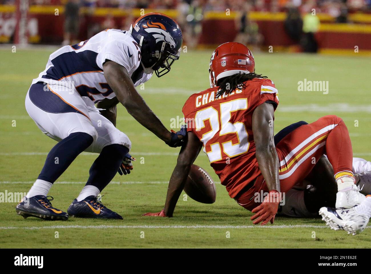 Kansas City Chiefs running back Jamaal Charles (25) fumbles the ball ...