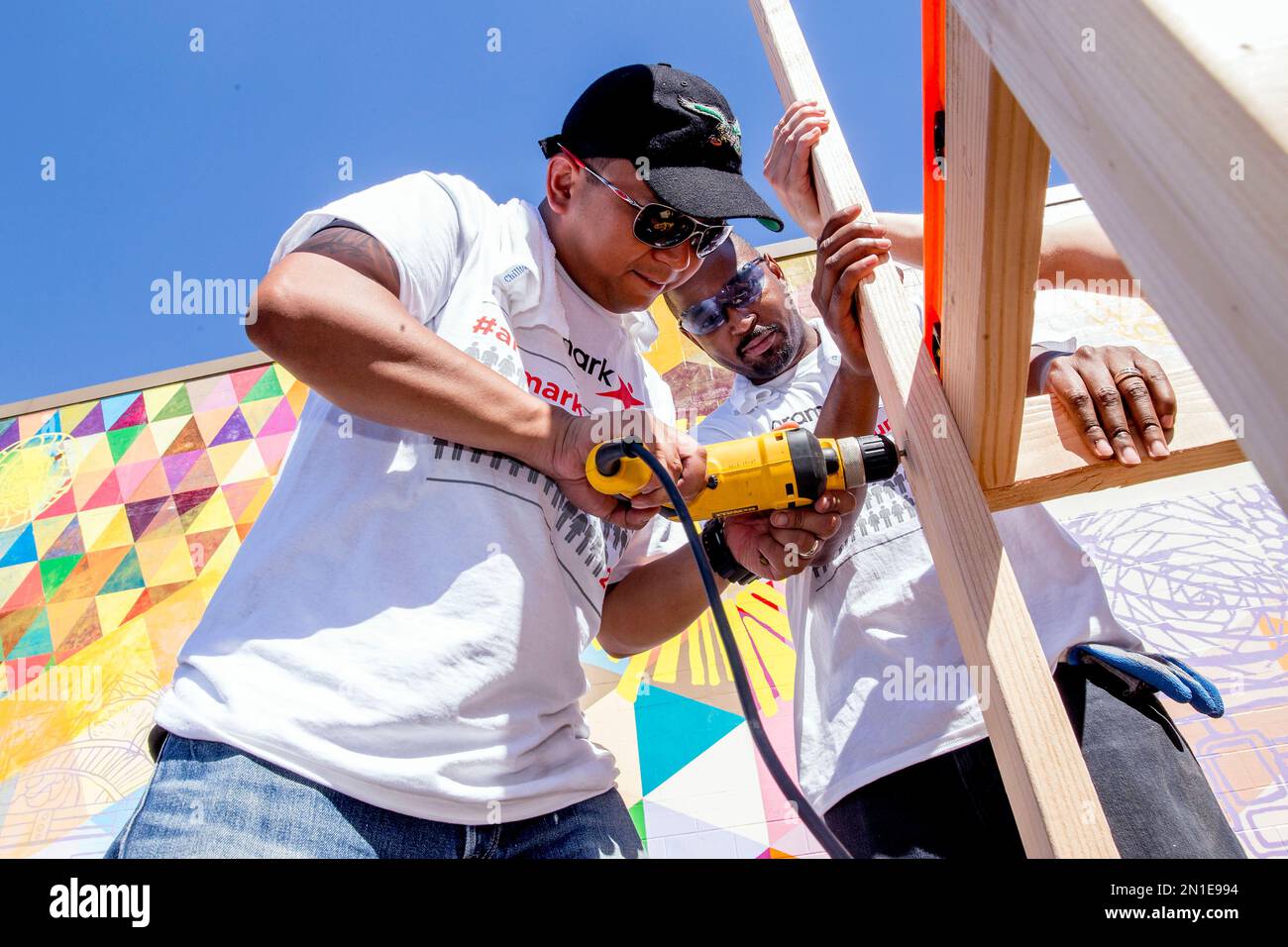 IMAGE DISTRIBUTED FOR ARAMARK - Aramark employees assist in building an ...