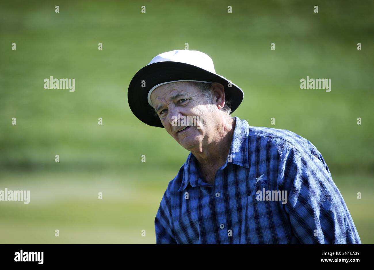 Actor Bill Murray looks towards the gallery on the third hole during ...