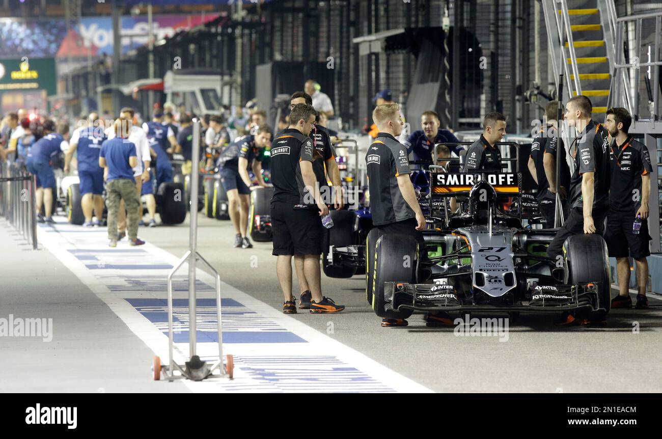 Cars line pit lane as they wait for scrutineering at the Marina Bay ...