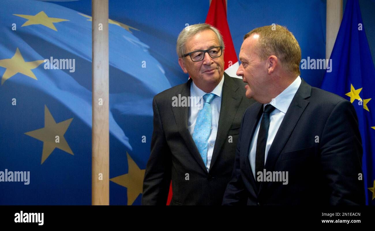 Danish Prime Minister Lars Lokke Rasmussen, right, is greeted by ...