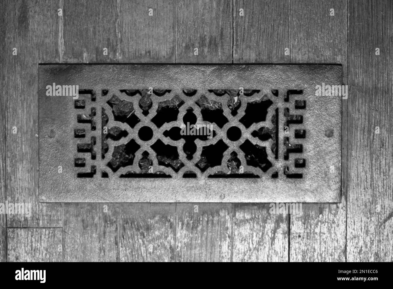 Antique medieval metal floor grate with a decorative repeating pattern ...
