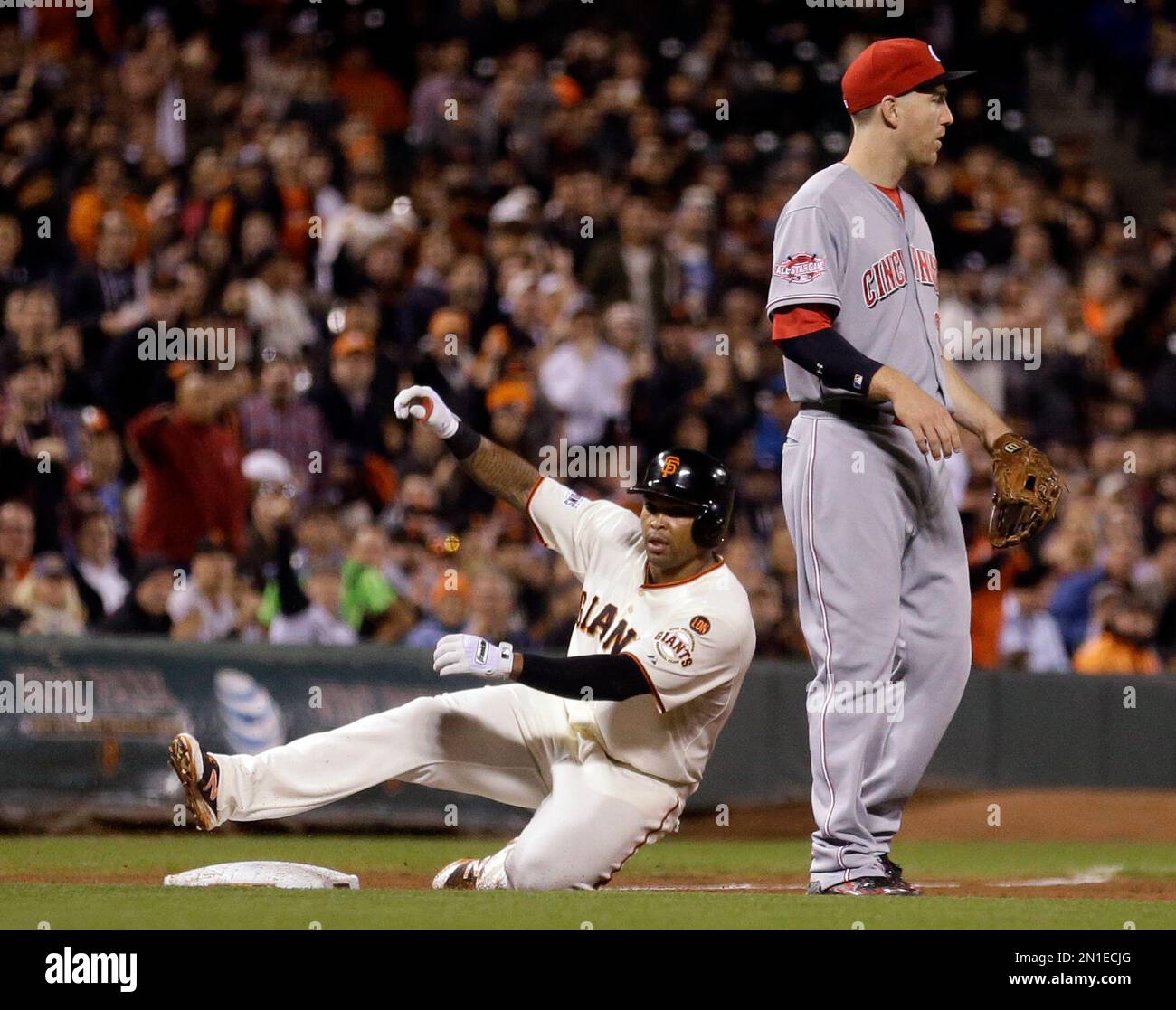 San Francisco Giants' Marlon Byrd, left, slides safe with an RBI triple ...
