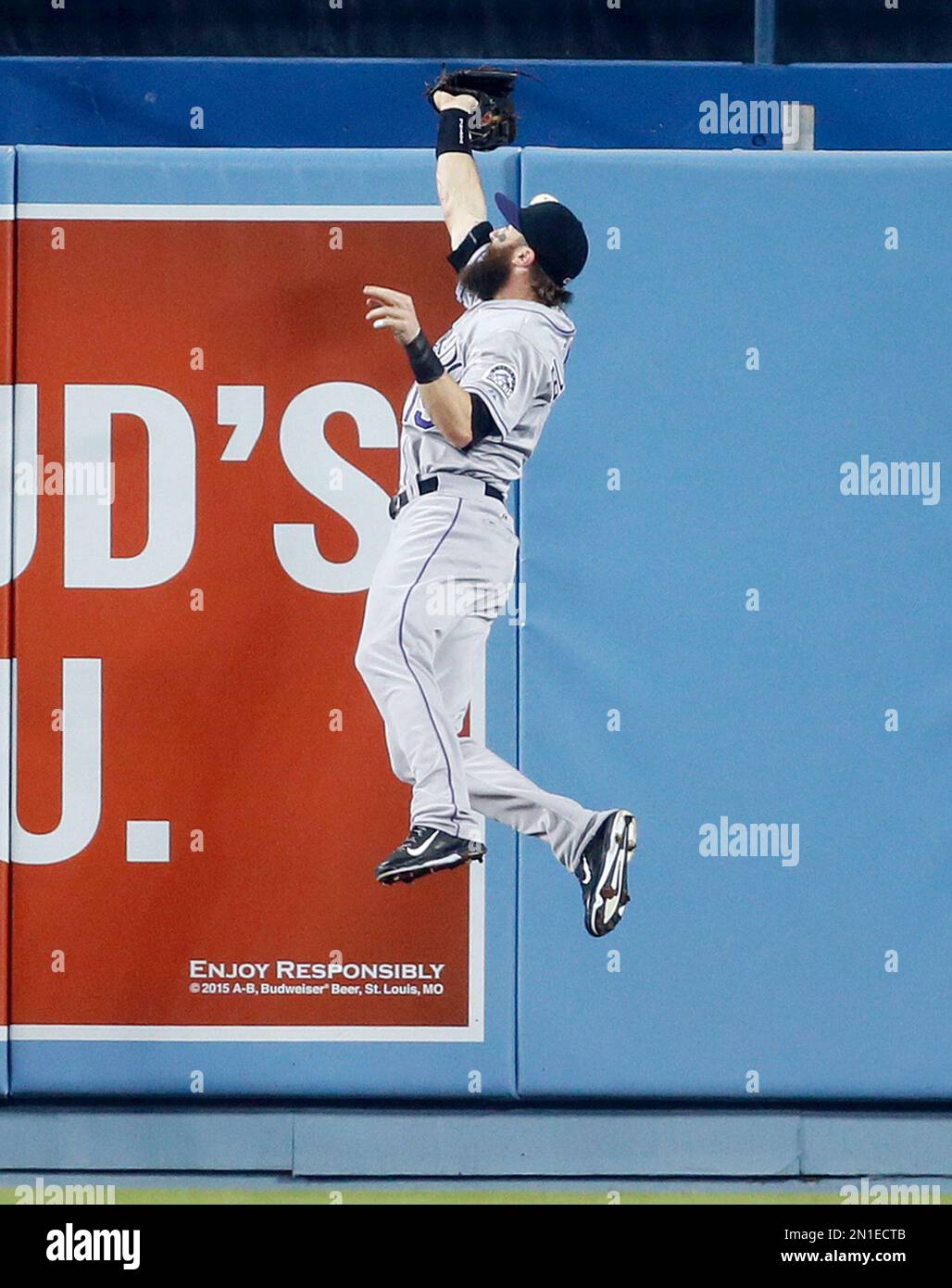 Colorado Rockies center fielder Charlie Blackmon can't catch a triple ...