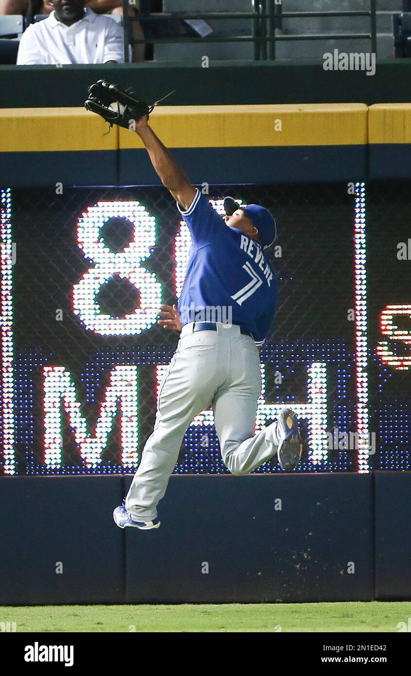 Toronto Blue Jays left fielder Ben Revere (7) makes a leaping catch for ...