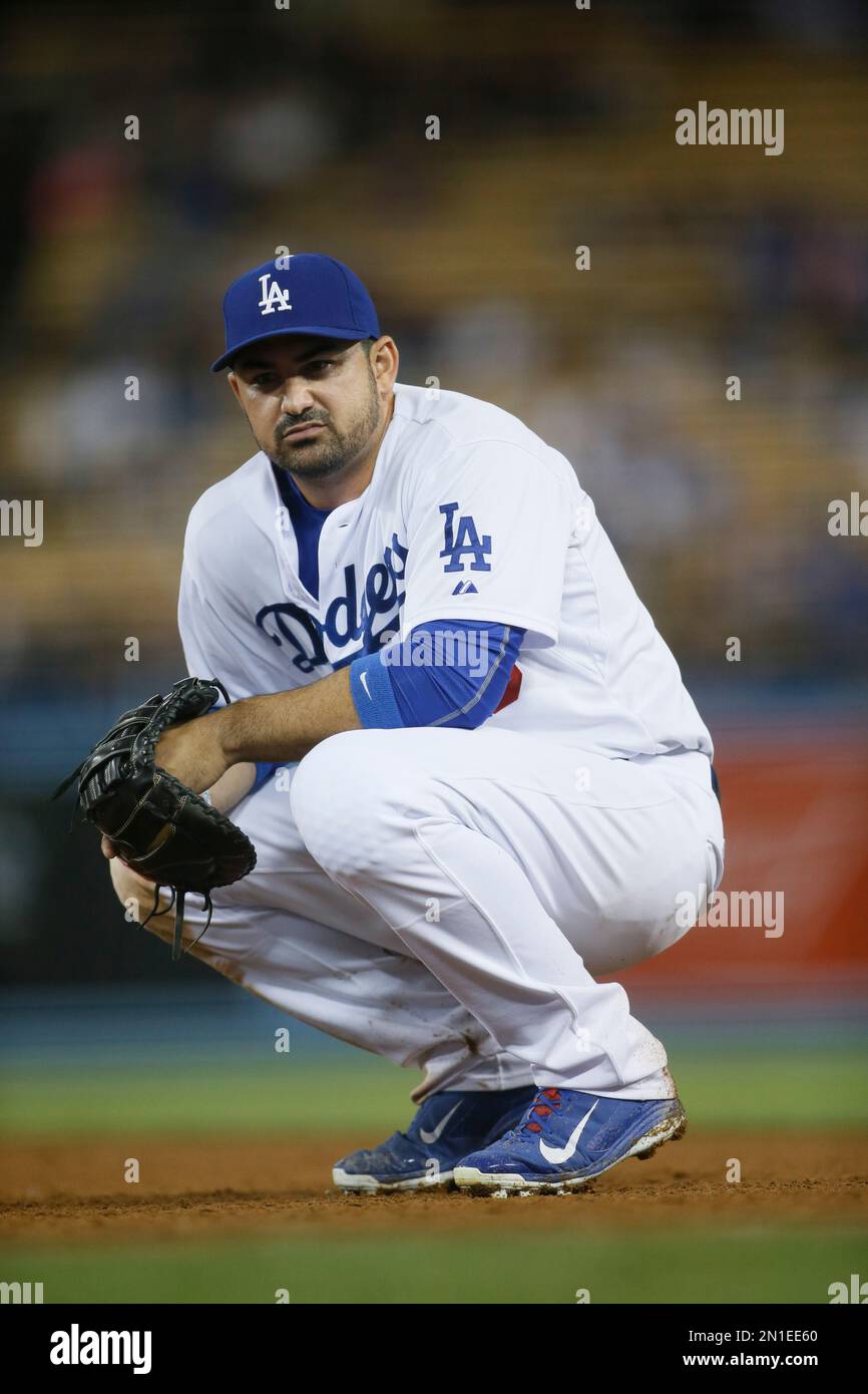 Los Angeles Dodgers first baseman Adrian Gonzalez kneels against the ...
