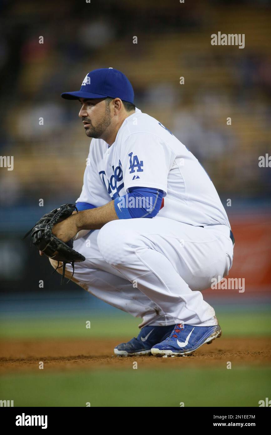 Los Angeles Dodgers first baseman Adrian Gonzalez kneels against the ...