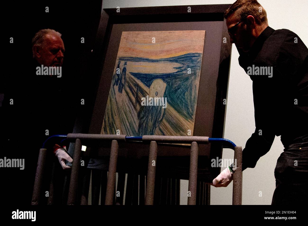 Museum employees hang the first version of Edvard Munch's "The Scream ...