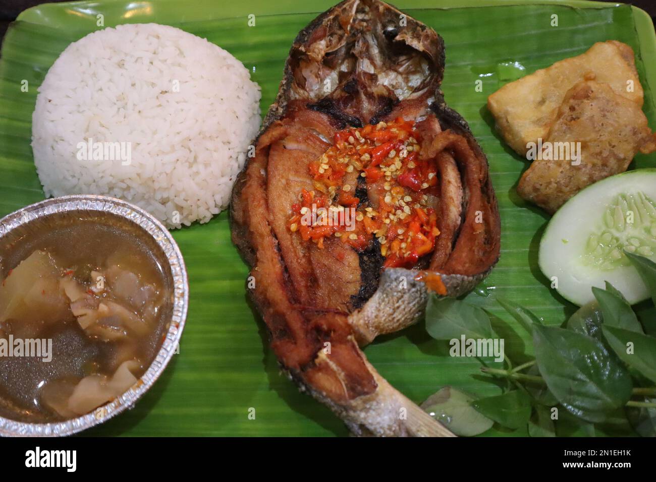 Fried fish with sambal, vegetables from Indonesia with white rice ...
