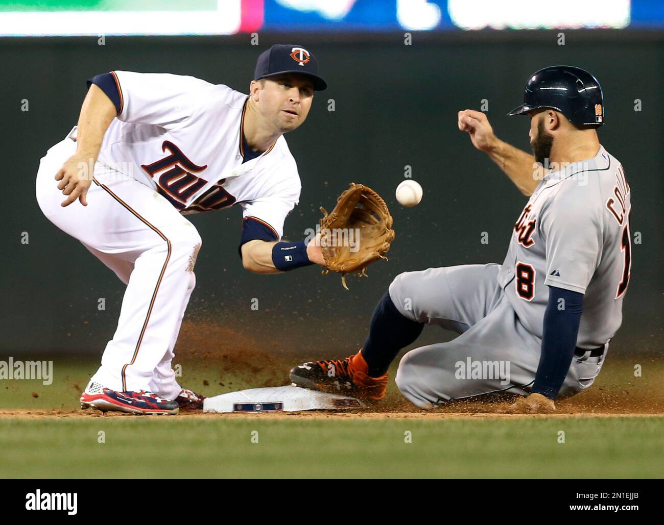 Detroit Tigers’ Tyler Collins, right, beats the throw to Minnesota ...