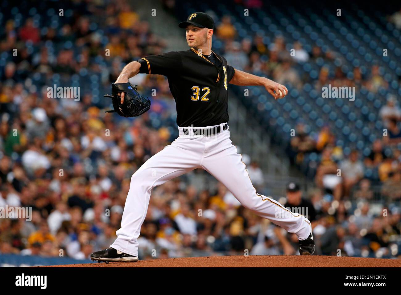 Pittsburgh Pirates starting pitcher J.A. Happ winds up during the first ...