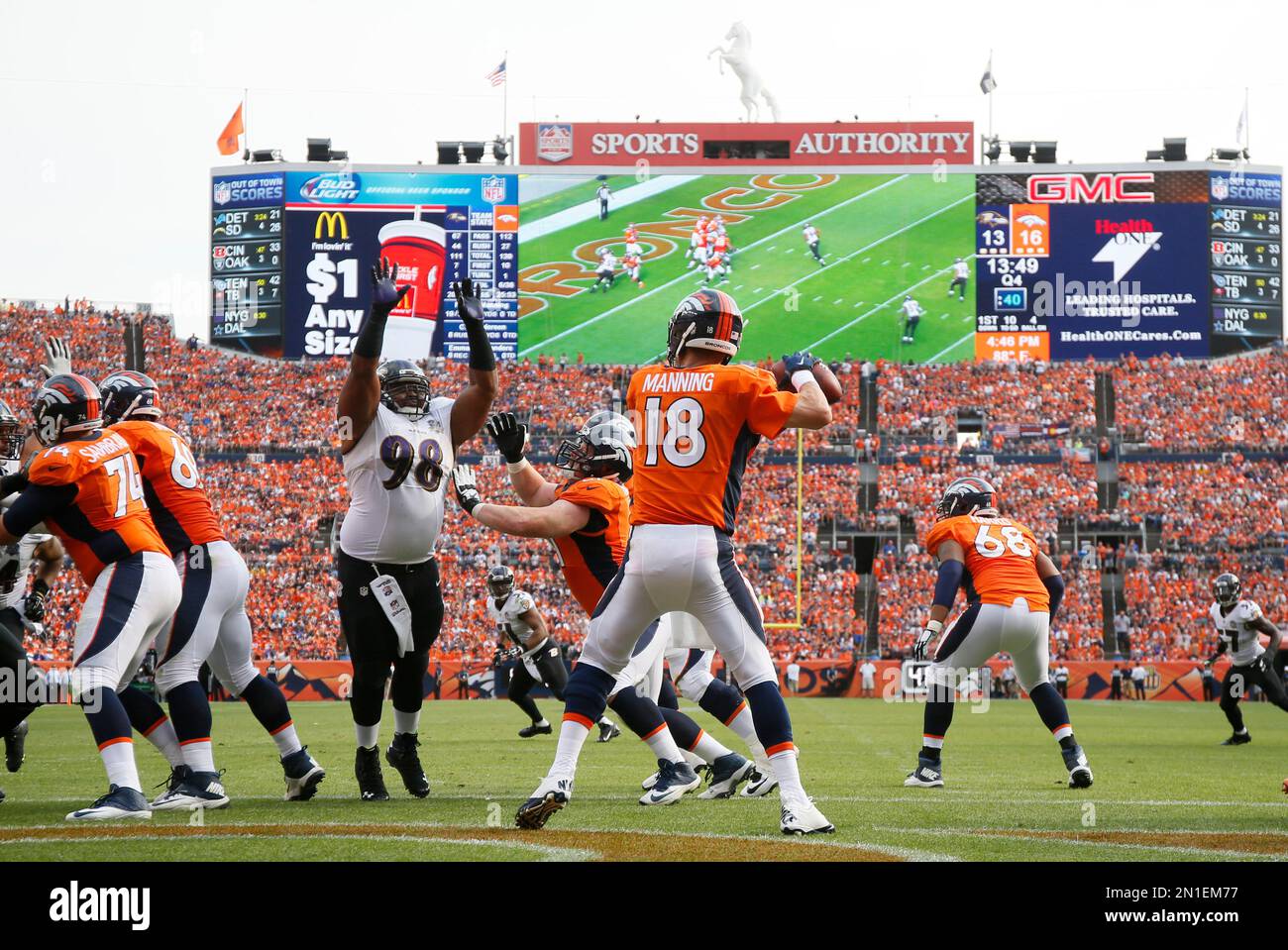 Denver Broncos quarterback Peyton Manning twos under pressure from ...