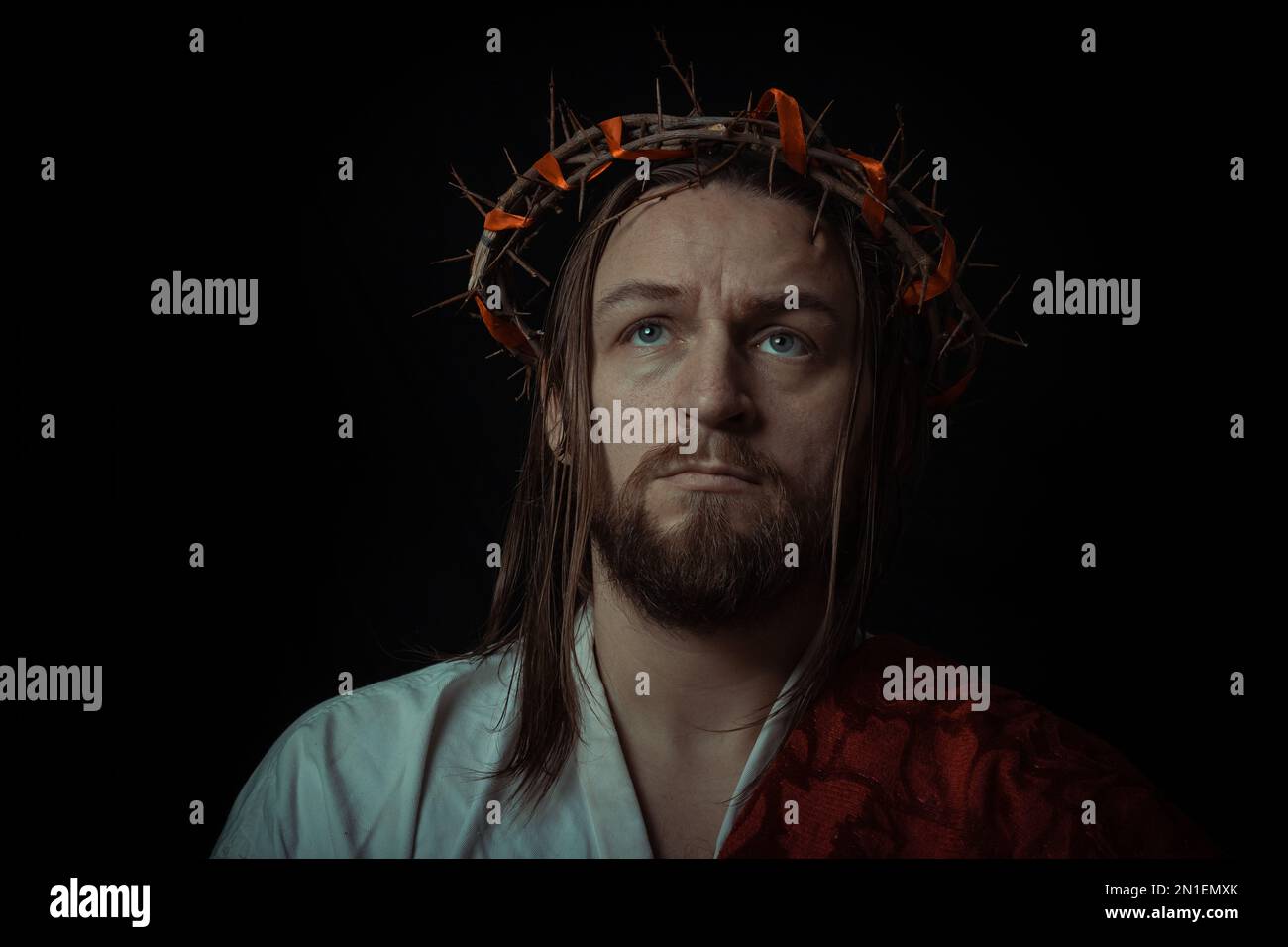 Jesus Christ wearing a crown of thorns and white chiton toga mantle ...