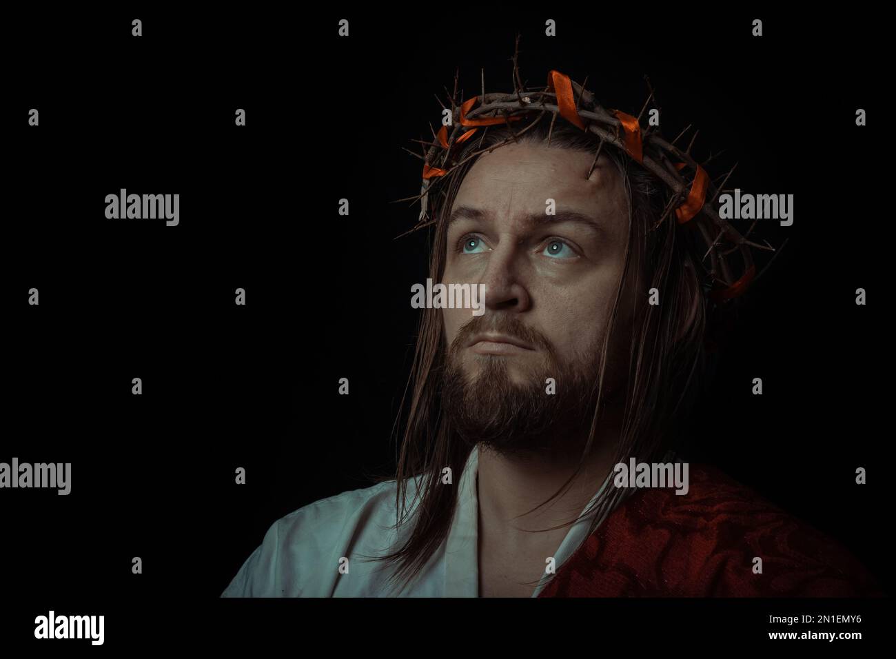 Jesus Christ wearing a crown of thorns and white chiton toga mantle ...