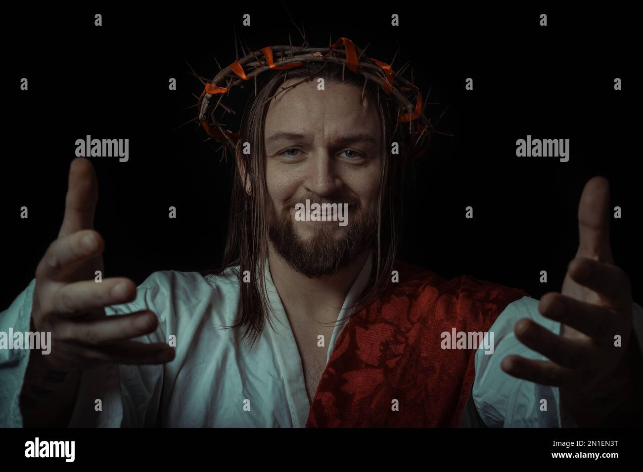 Jesus Christ wearing a crown of thorns and white chiton toga mantle ...