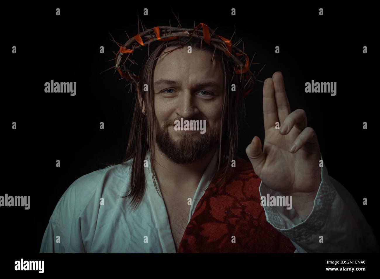 Jesus Christ wearing a crown of thorns and white chiton toga mantle ...