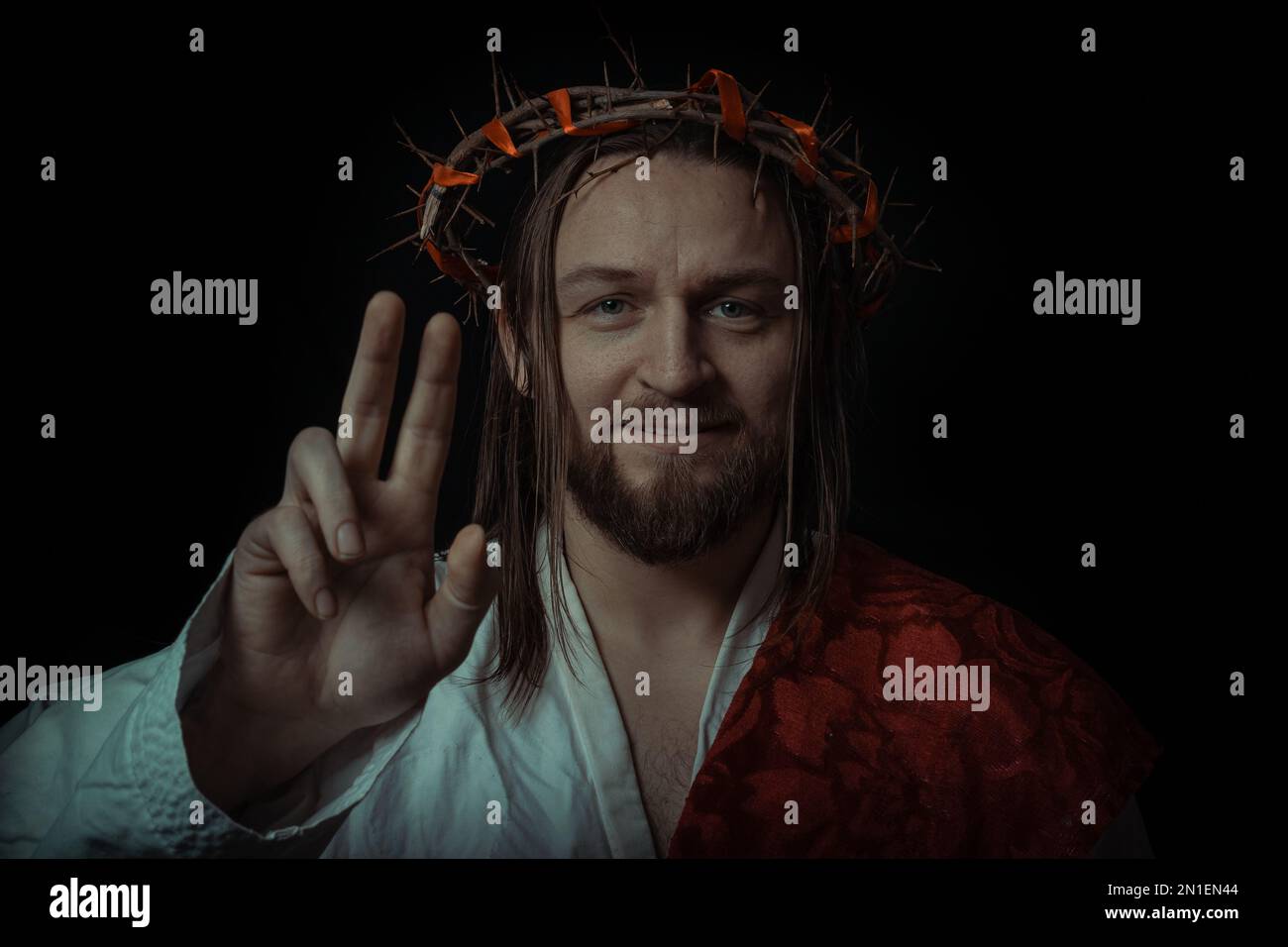 Jesus Christ wearing a crown of thorns and white chiton toga mantle ...