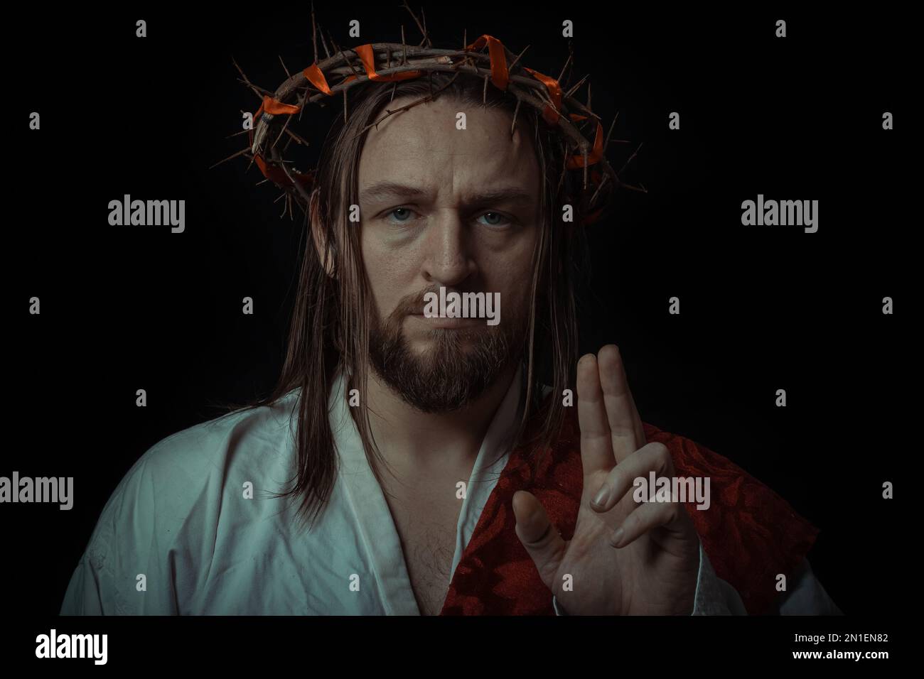 Jesus Christ wearing a crown of thorns and white chiton toga mantle ...