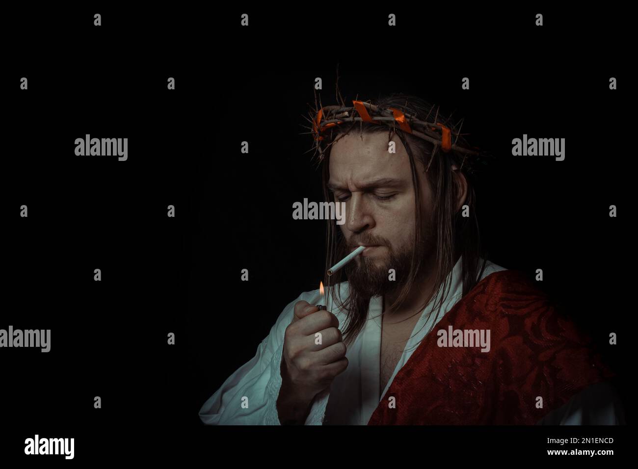 Jesus Christ smokes a cigarette wearing a crown of thorns and white ...