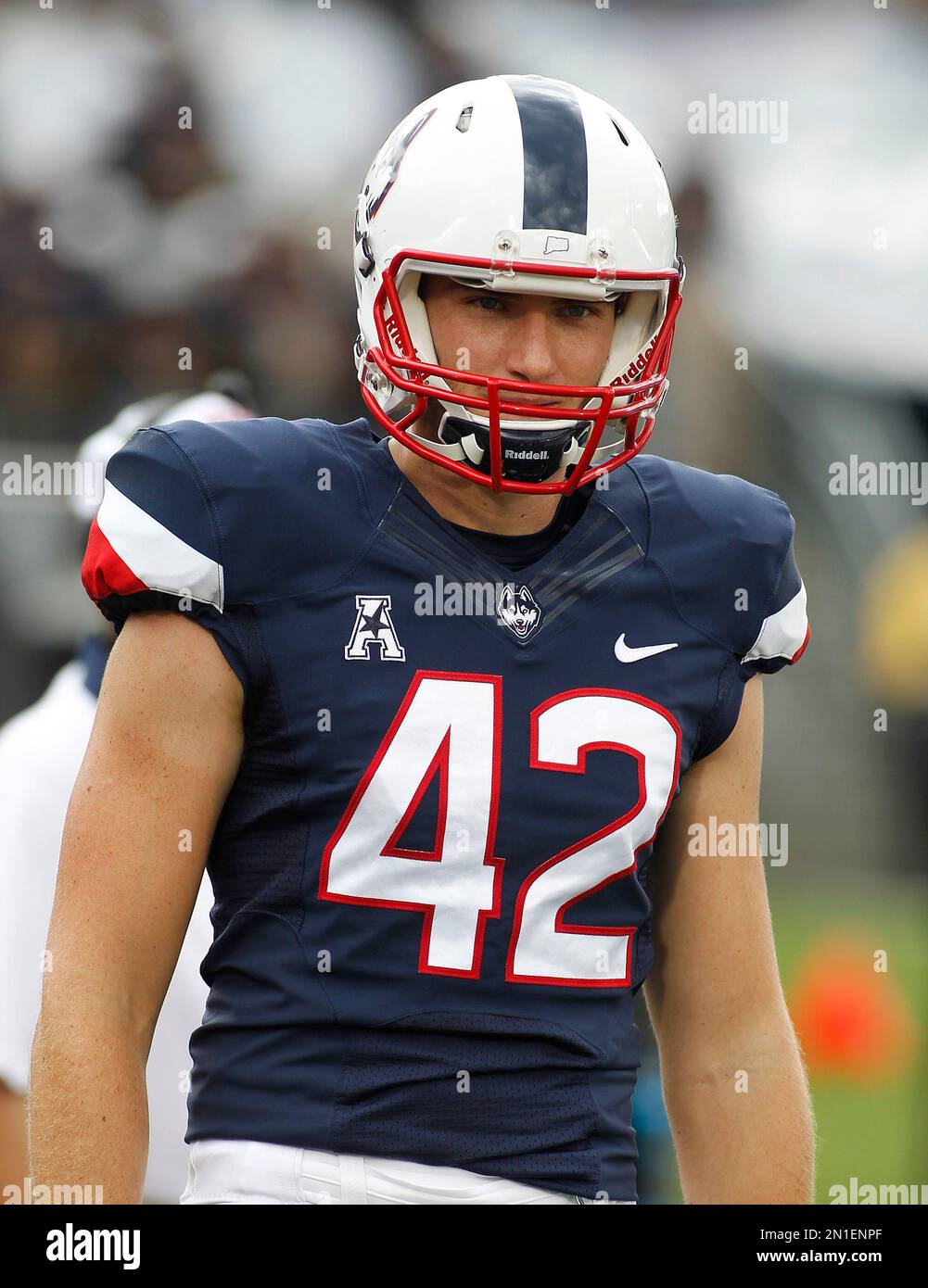 Connecticut punter Justin Wain (42) during the fourth quarter of an ...