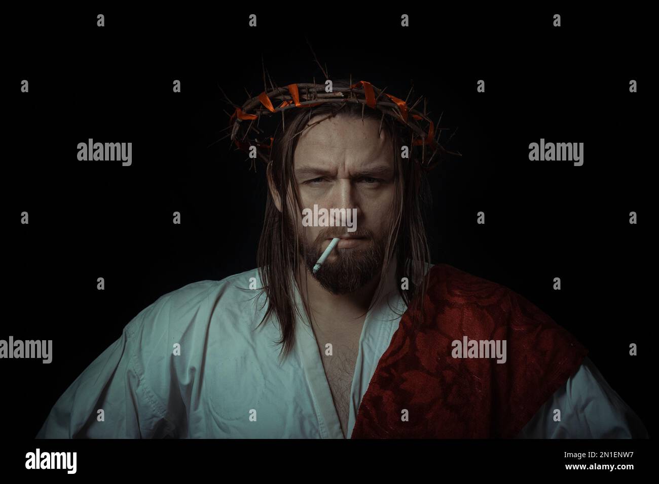 Jesus Christ smokes a cigarette wearing a crown of thorns and white ...