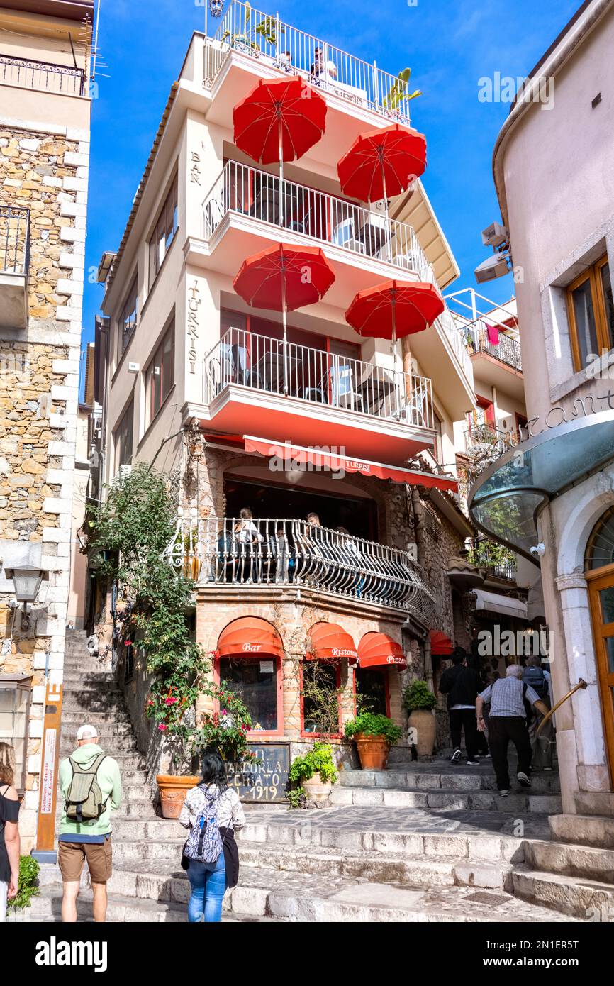 Castelmola, Sicily, Italy, Bar Turrisi with bright red parasols over ...
