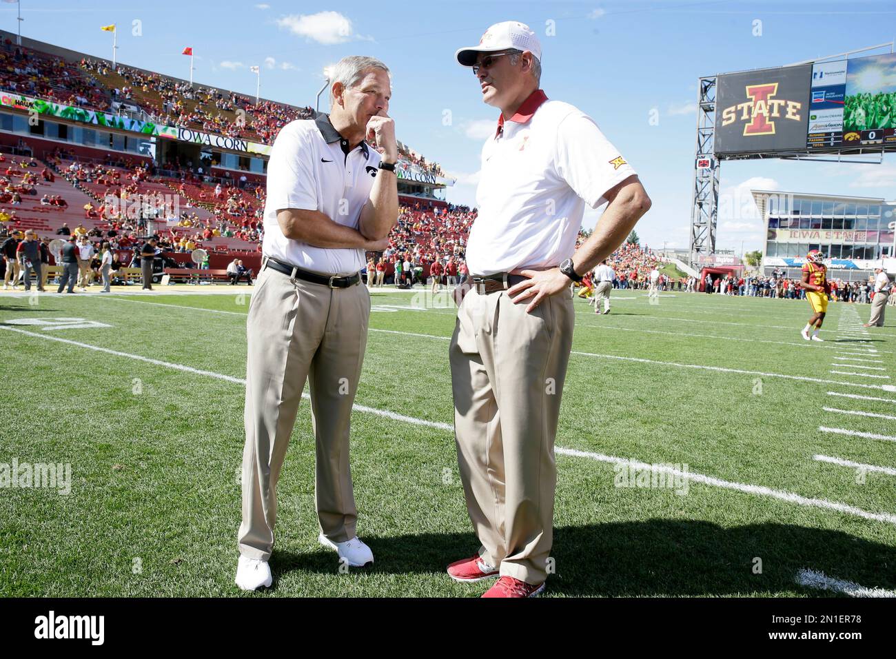 Iowa head coach Kirk Ferentz, left, talks with Iowa State head coach ...