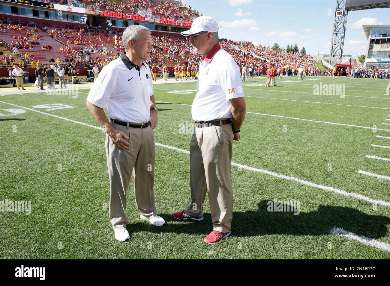 Iowa head coach Kirk Ferentz, left, talks with Iowa State head coach ...