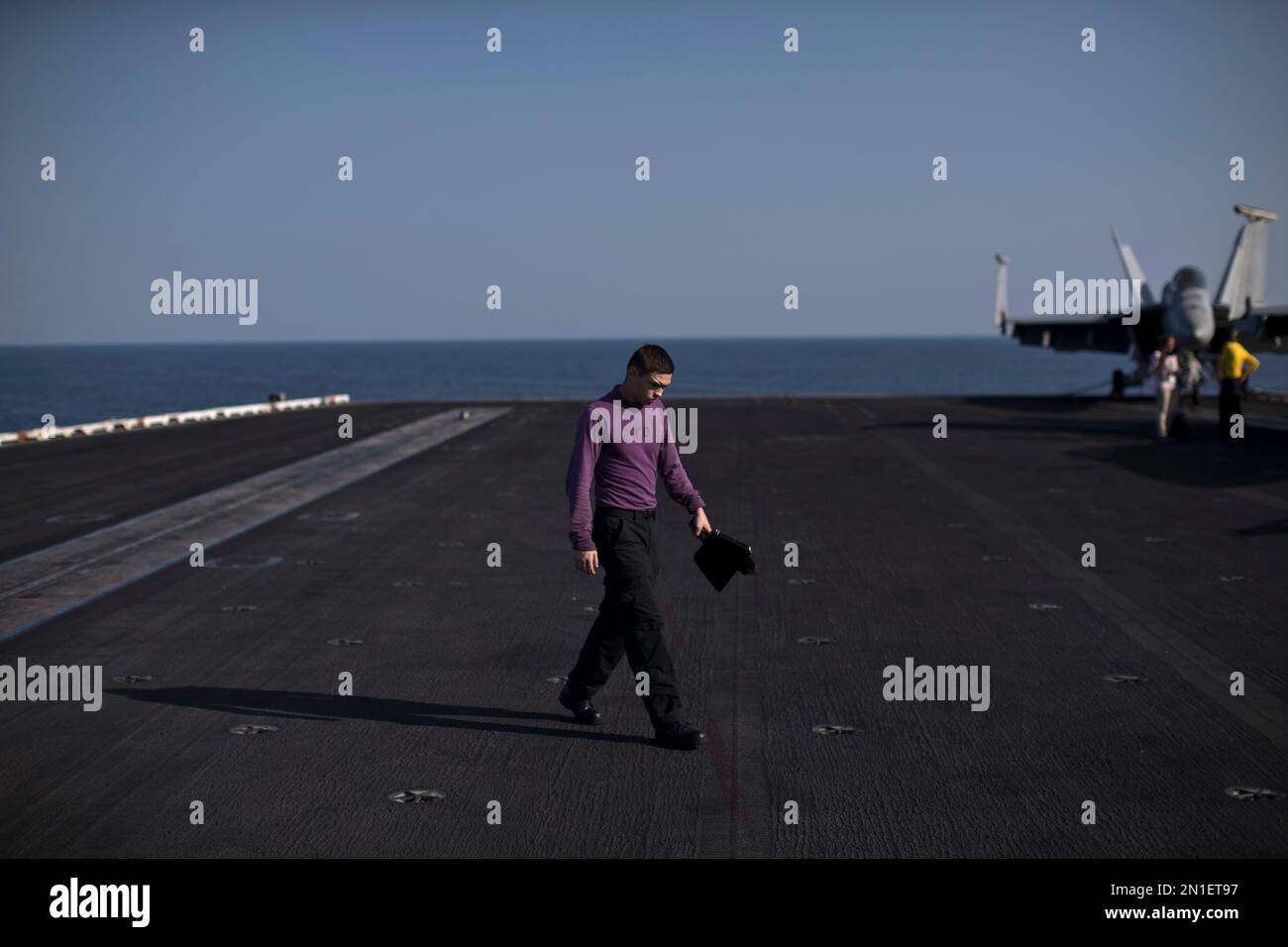 A U.S. Navy sailor that is part of the Aviation Fuels team, dressed in ...