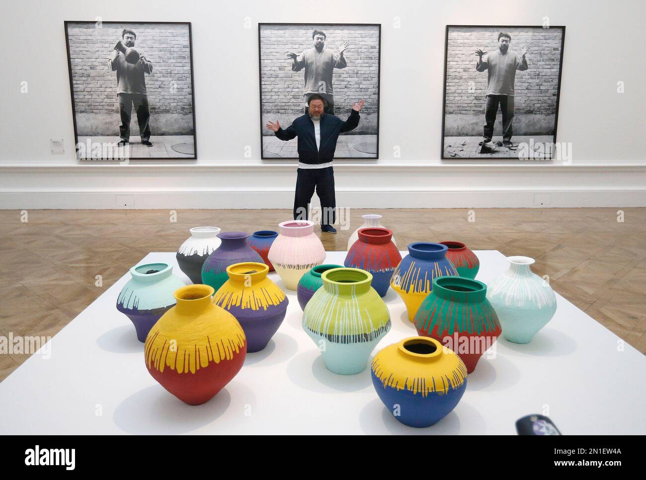 Chinese artist Ai Weiwei poses for photographers with his work at his ...