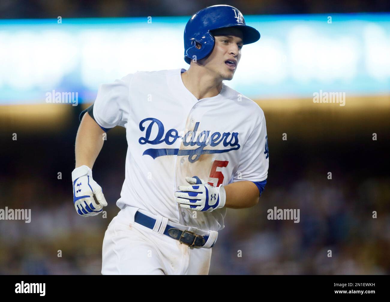 Los Angeles Dodgers shortstop Corey Seager runs to first base after ...