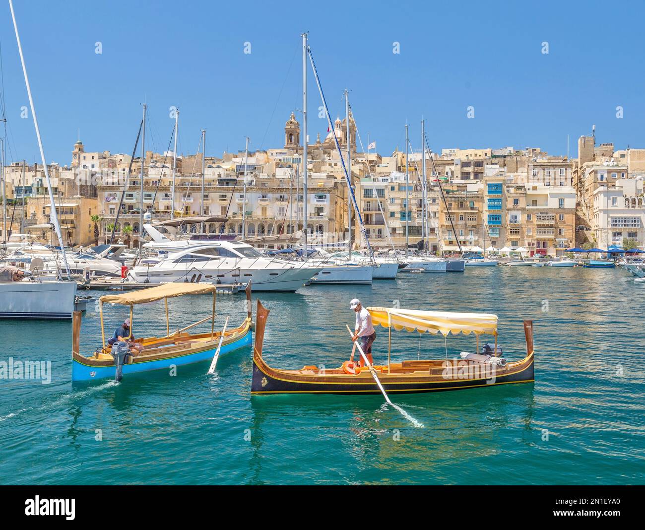 Traditional water taxis at The Three Cities, Grand Harbour, Valletta ...