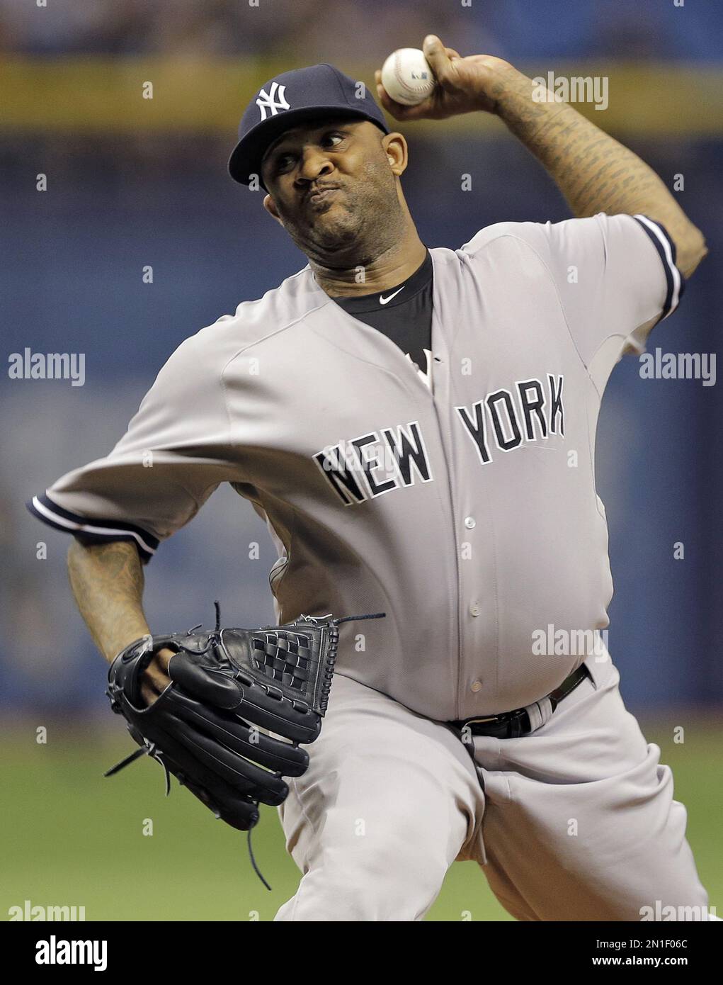 New York Yankees starting pitcher CC Sabathia delivers to the Tampa Bay ...