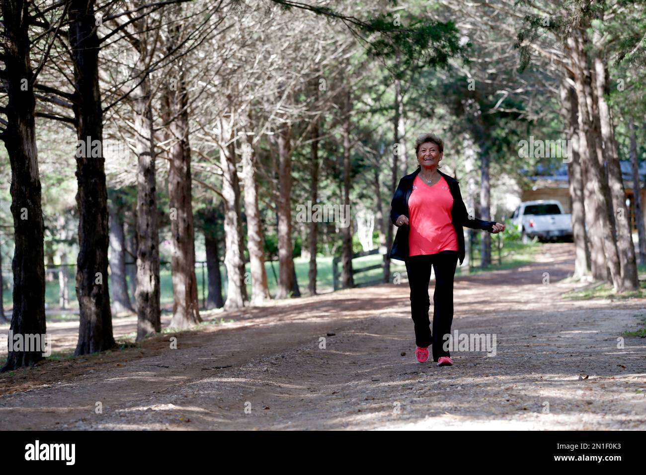 Martha Karolyi walks down the road on her way to a training gym at the ...