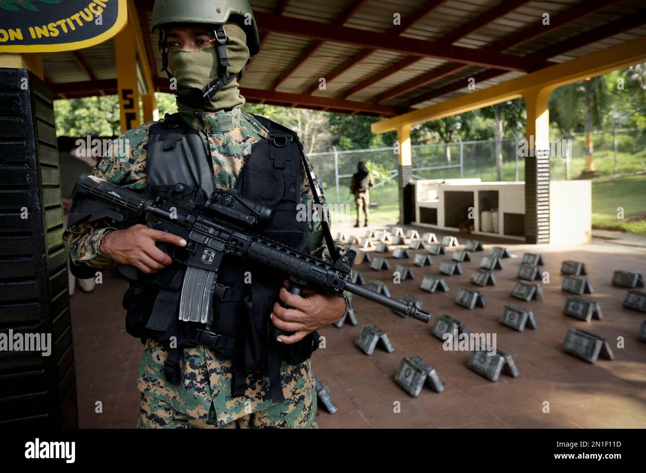 A Panamanian border police officer stands guard during a press ...