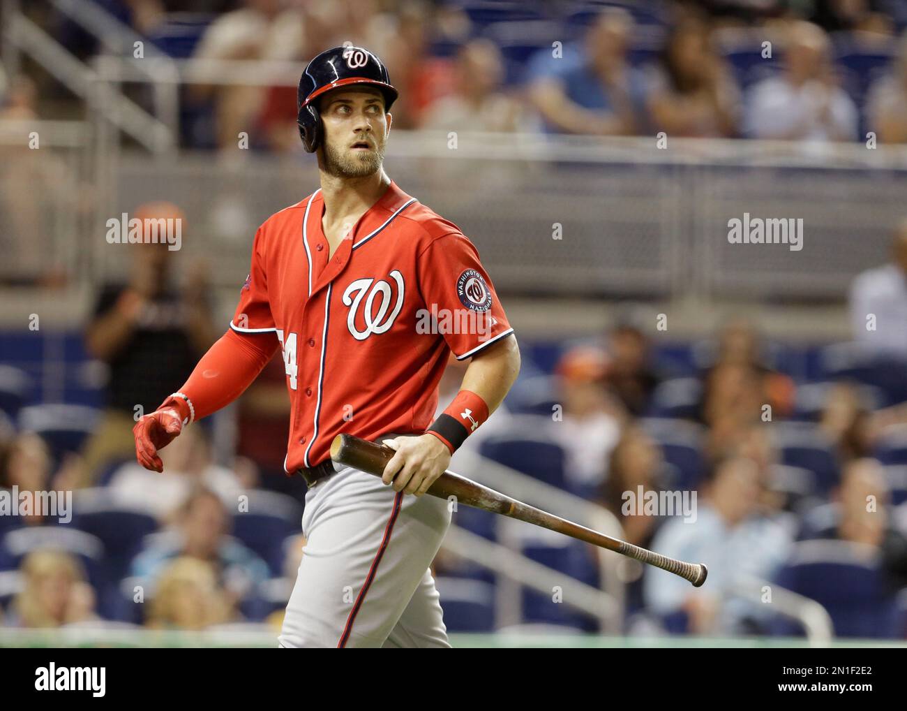 Washington Nationals' Bryce Harper walks to the dugout after striking ...
