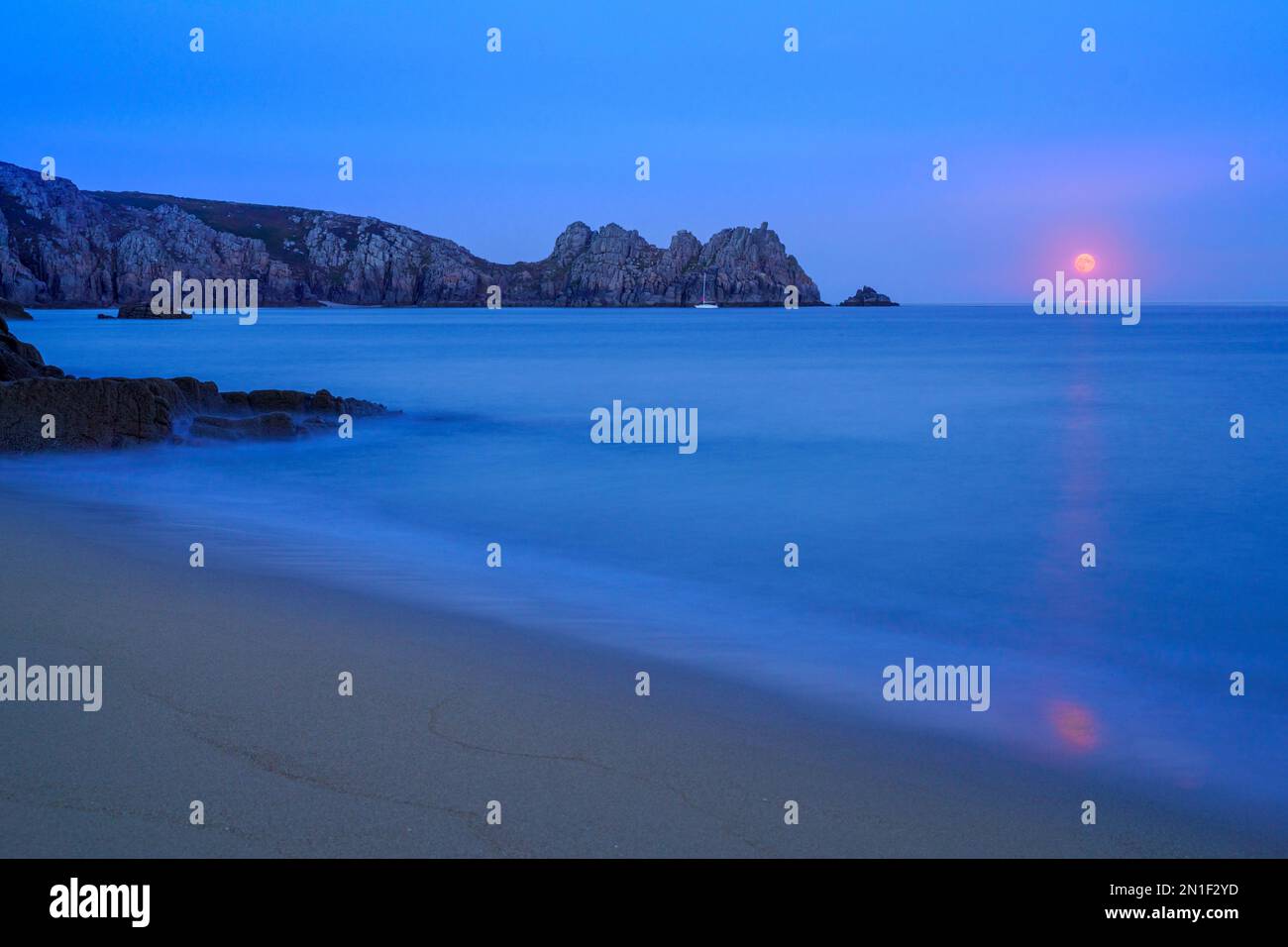 Porthcurno at dusk, moon above the horizon, Cornwall, England, United ...