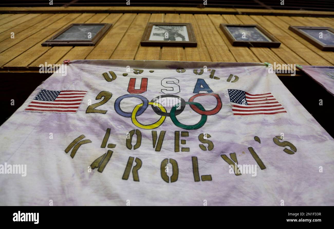 A banner hangs on the wall inside a gymnastics training gym at the ...