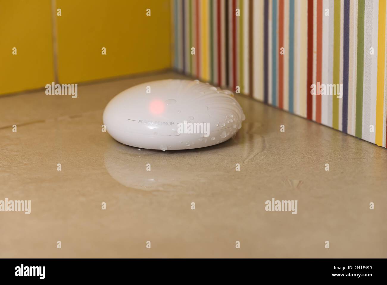 Smart home concept. After accident with plumbing pipe water leaking on ...