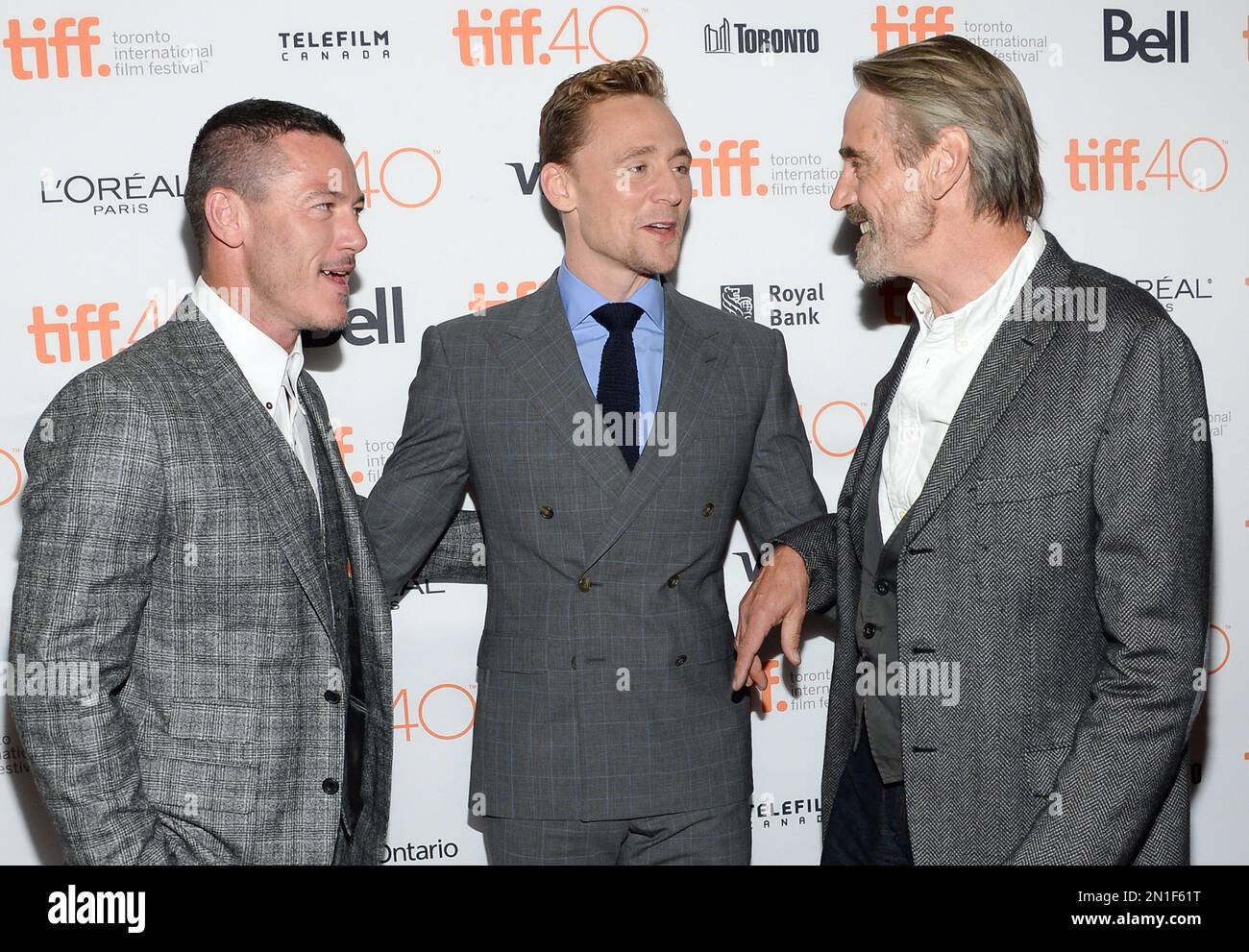 Actors Luke Evans, left, Tom Hiddleston and Jeremy Irons attend the ...