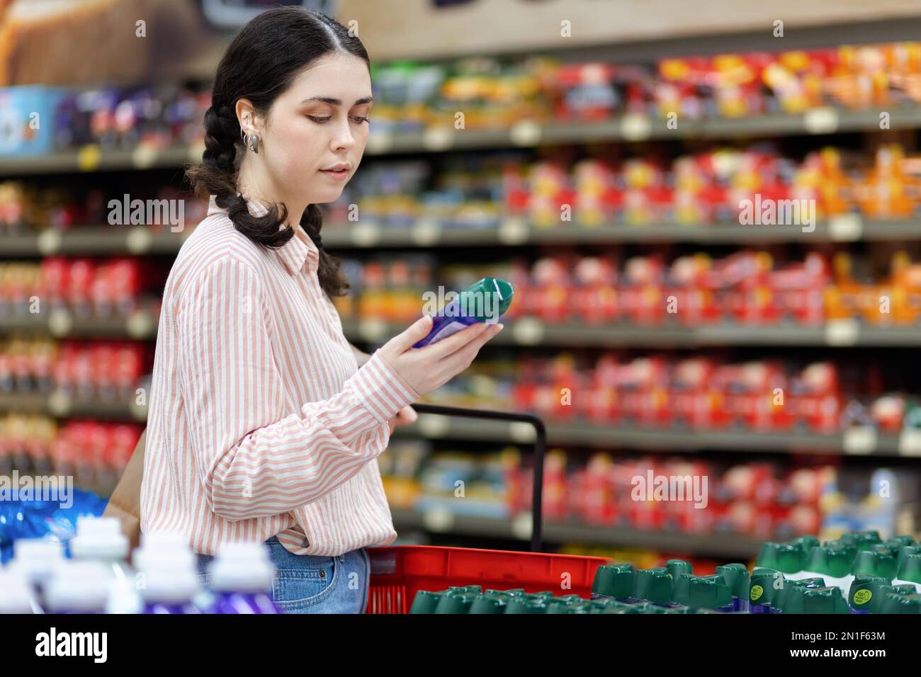 Visit grocery store. Young attractive caucasian woman looking of ...